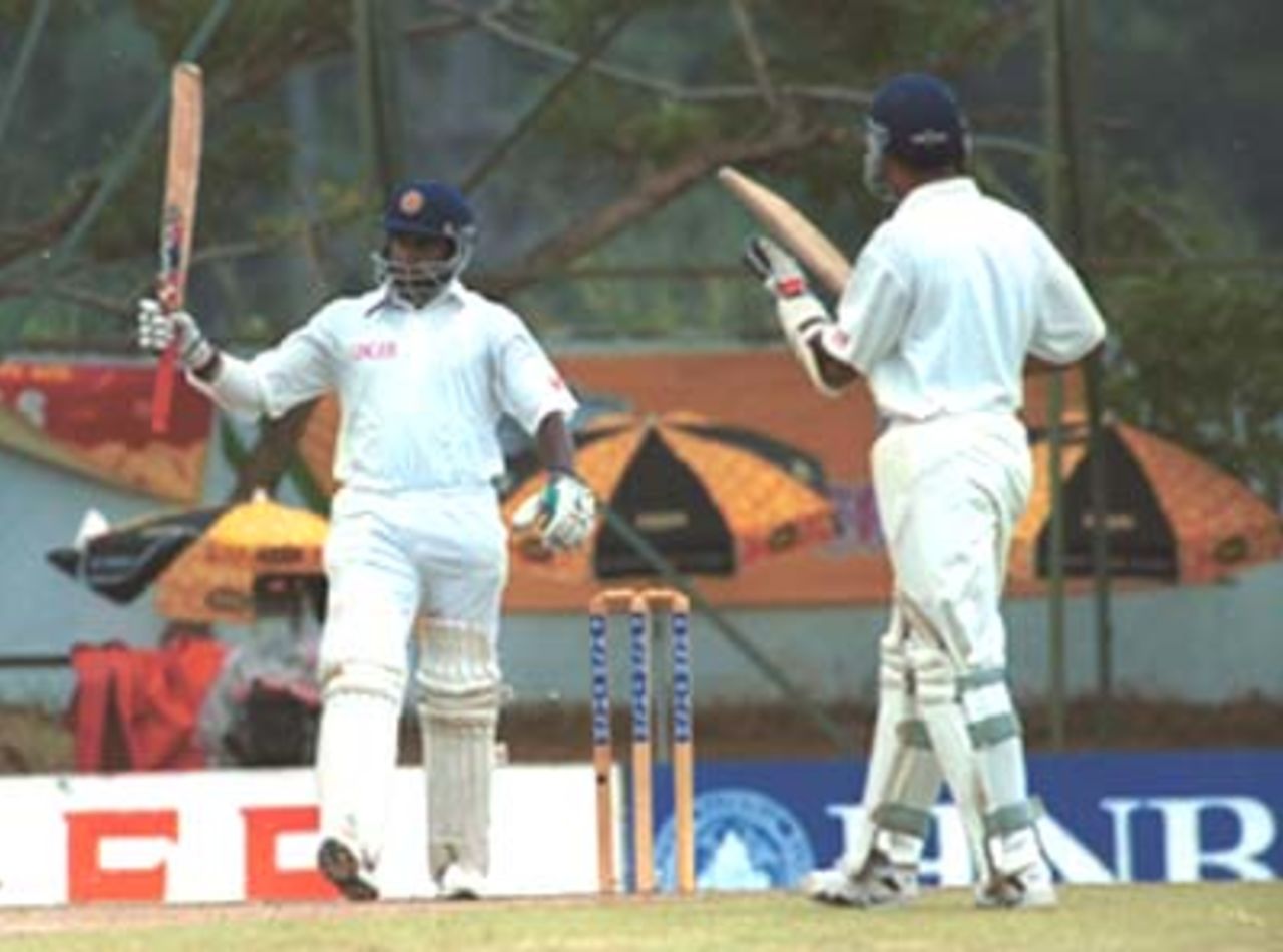 Sri Lankan batsman Sanath Jayasuriya and Marvan Atapattu celebrate as ...