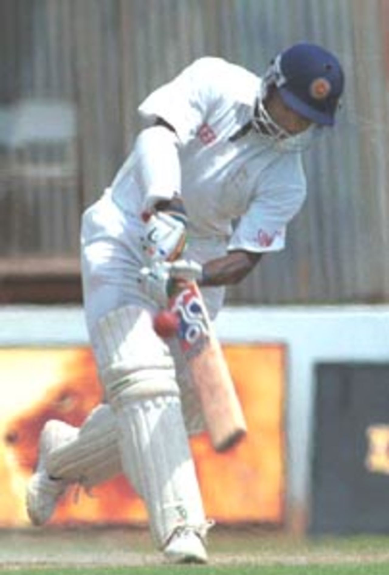 Jayasuriya signals to the pavilion for a change of helmet ...