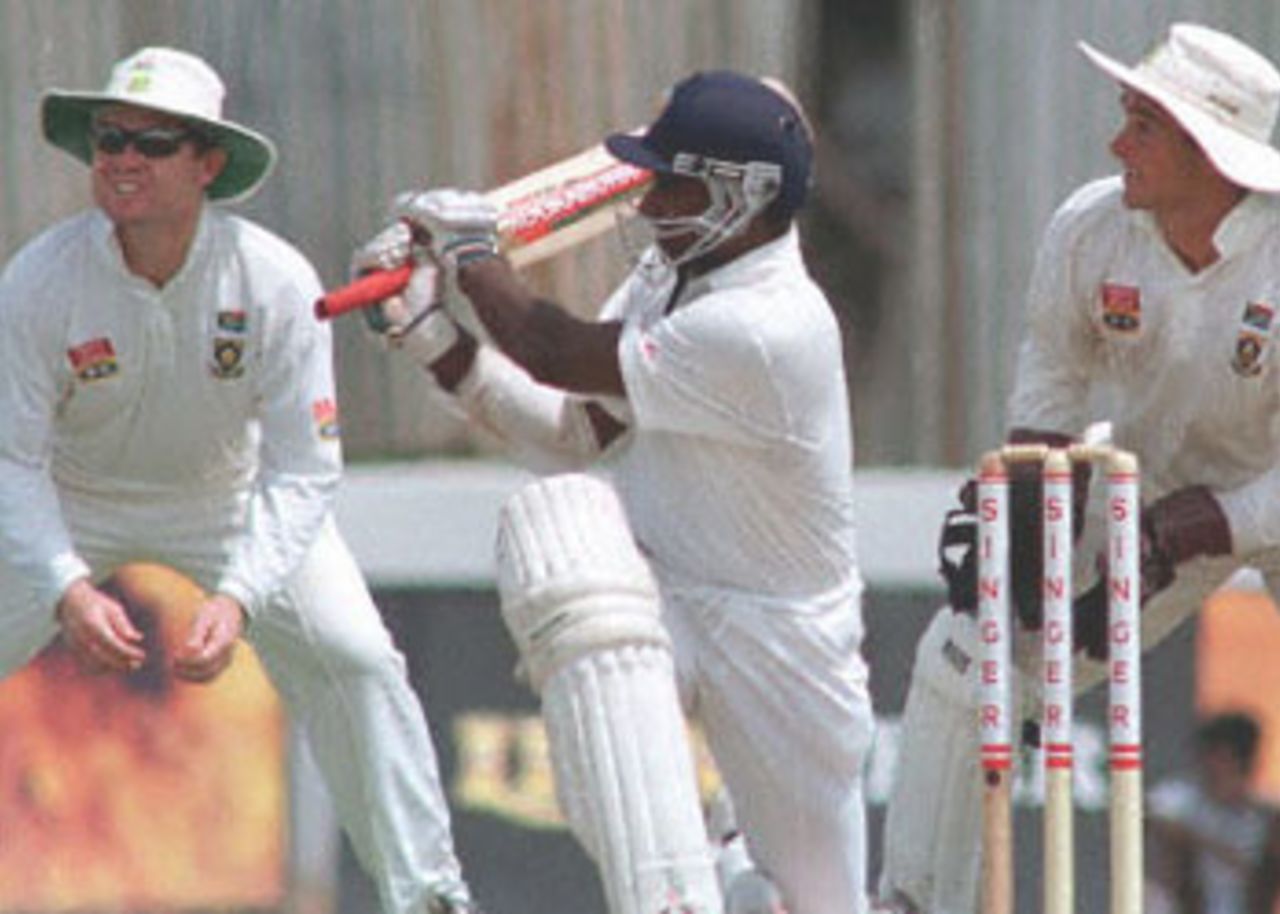 Boucher makes a desperate attempt to collect the ball as Jayasuriya ...