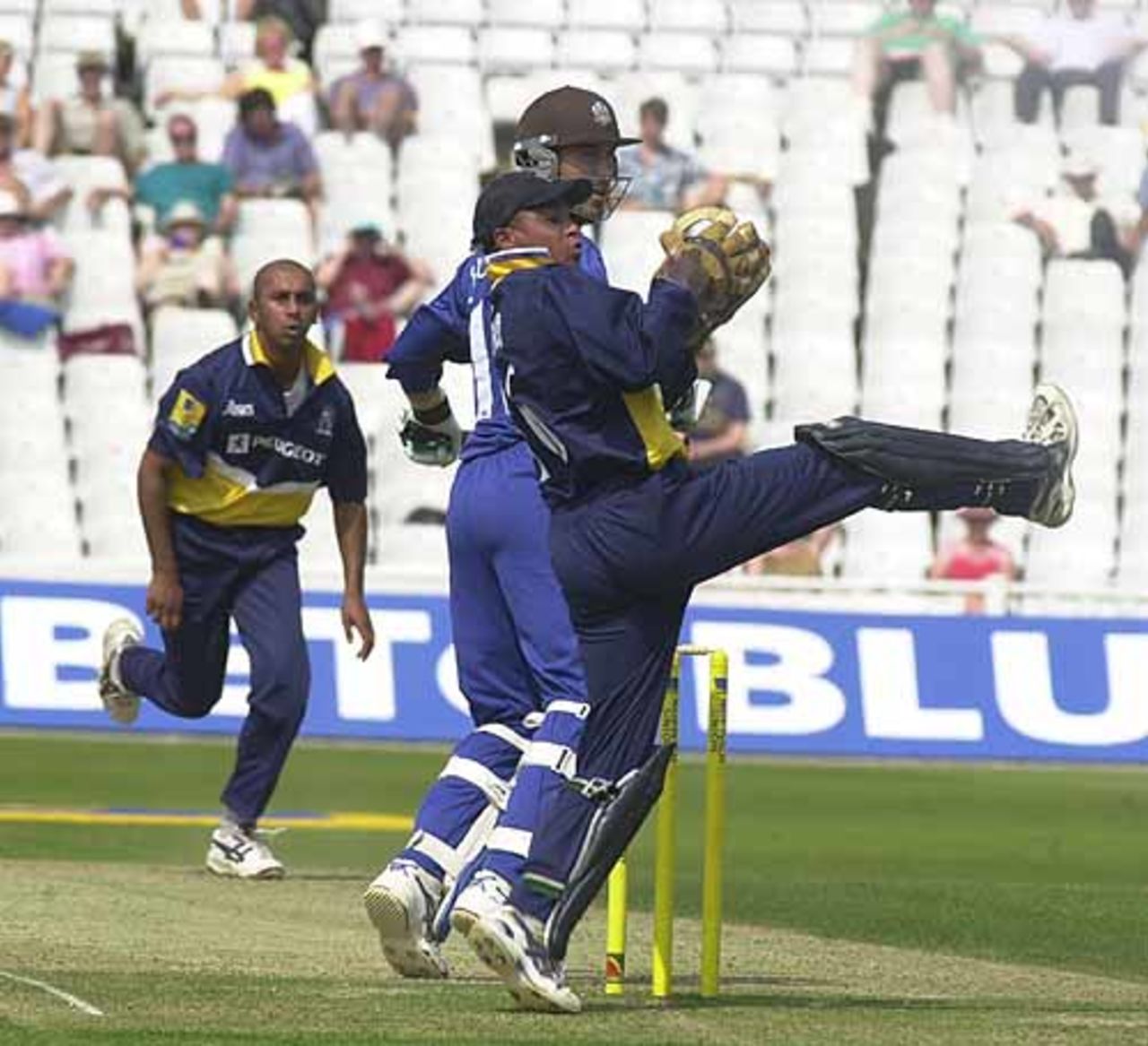 Keith Piper cannot prevent a Ben Hollioake off side dab from going to ...