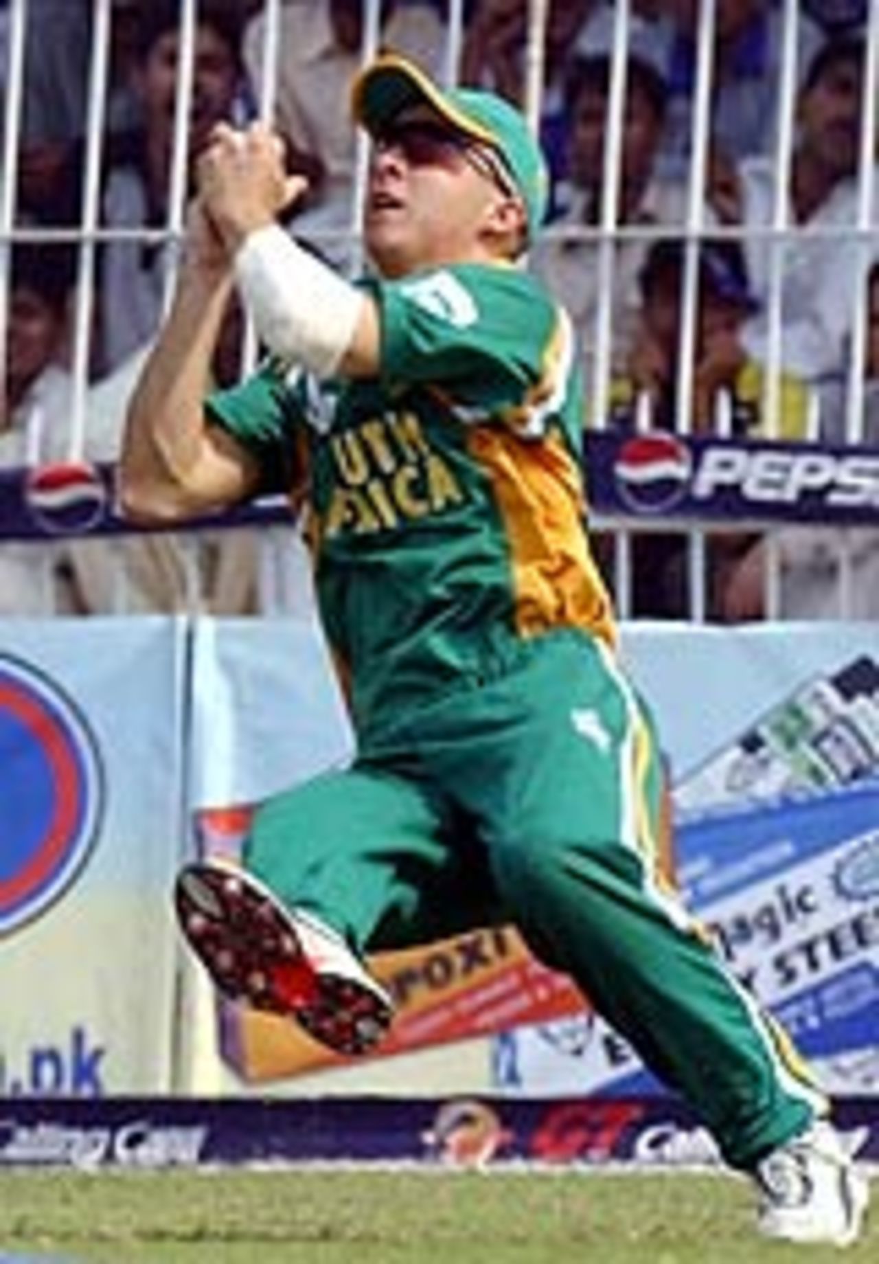 South Africa's Boeta Dippenaar clings on to a catch to dismiss Mohammad ...