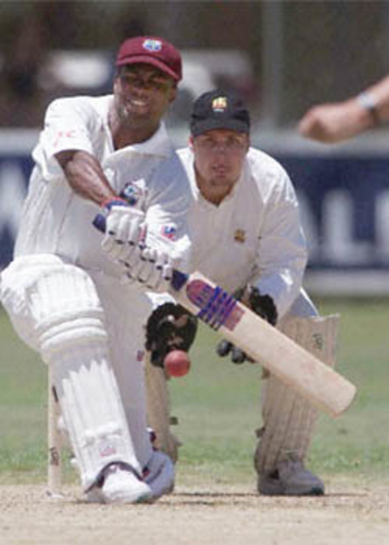 Lara holding one year old baby Wednesday Pyle | ESPNcricinfo.com