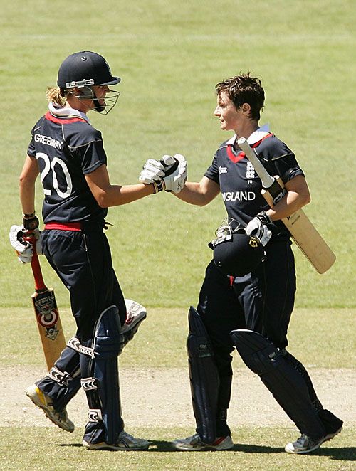 Lydia Greenway congratulates Claire Taylor on her century ...