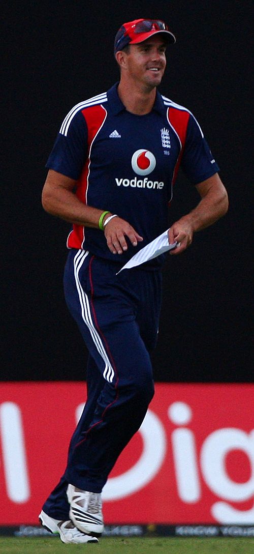 A smiling Kevin Pietersen runs onto the pitch with the Duckworth-Lewis ...
