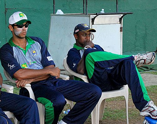 Michael Vandort and Ajantha Mendis watch a game in progress ...