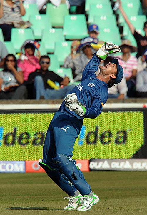Adam Gilchrist is ecstatic after snapping a catch off Sanath Jayasuriya ...