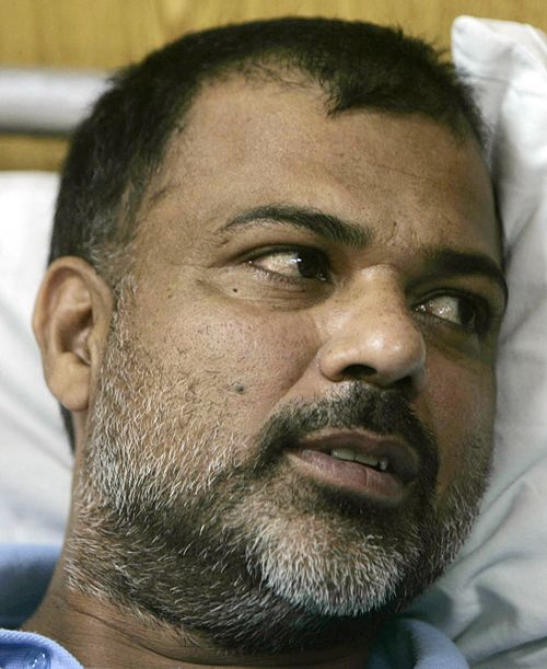 Ijaz Ahmed speaks to reporters at a local hospital in Lahore ...