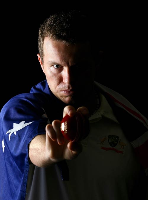 Peter Siddle poses draped in the Australian flag | ESPNcricinfo.com