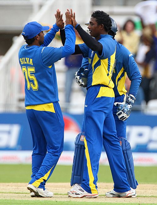 Ajantha Mendis is congratulated on picking up Xavier Marshall's wicket ...
