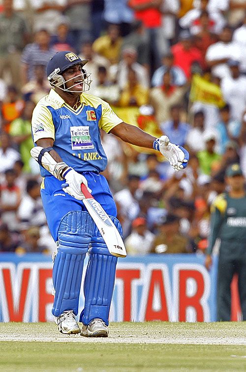 Sanath Jayasuriya shows his frustration after being involved in a run-out with Kumar Sangakkara ...