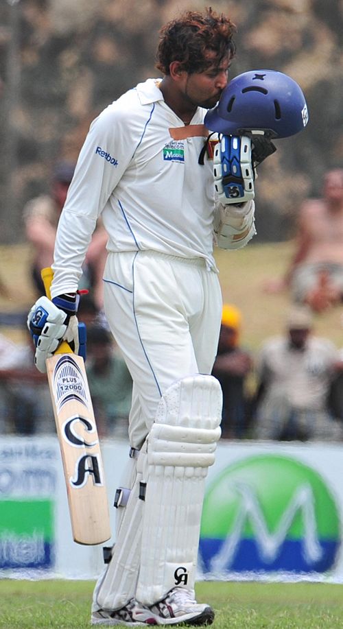 Tillakaratne Dilshan kisses his helmet on getting to his half-century ...