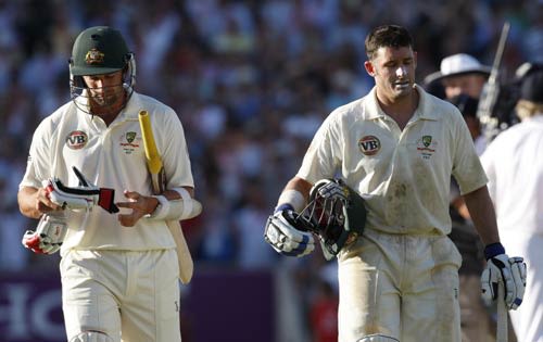 Michael Hussey and Ben Hilfenhaus trudge off after England won the ...