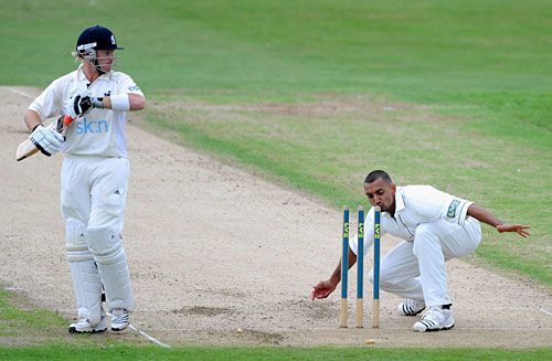 Ajmal Shahzad kisses the stumps as he celebrates the wicket of Ian Bell ...