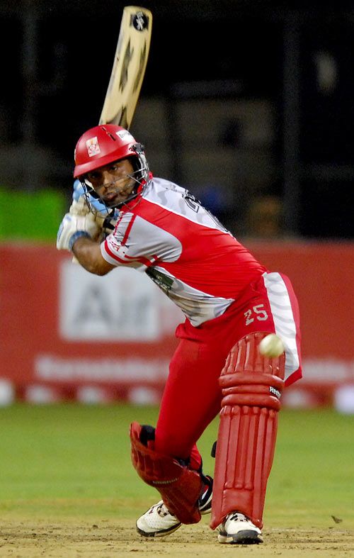 Mangalore United's Rohit Sabharwal shapes to smash the ball ...