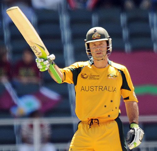 Ricky Ponting raises the bat after getting his half-century ...