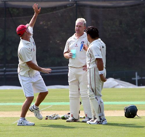 Todd Johnsen entertains Damian Kelleher and Roy Lamsam during a drinks ...