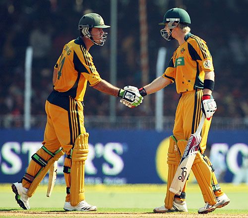 Tim Paine is congratulated by Ricky Ponting on getting to fifty ...