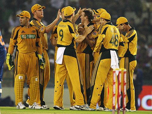 Nathan Hauritz gets the congratulations after dismissing Suresh Raina ...