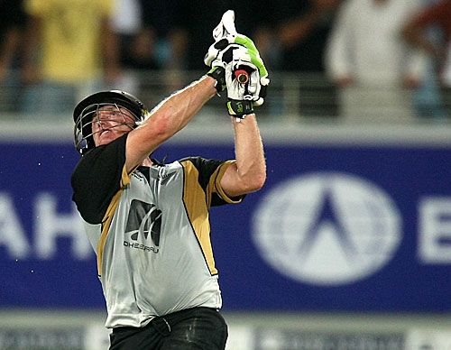 Scott Styris goes over the top during the tense final moments ...