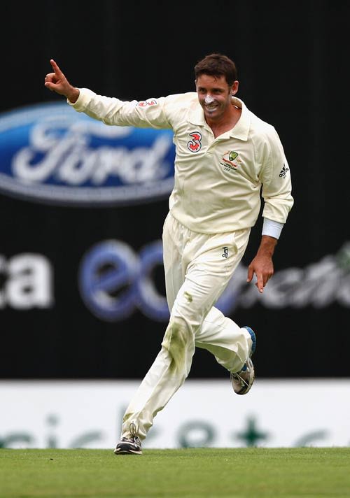 Michael Hussey celebrates his second wicket in Test cricket ...