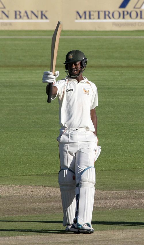 Foster Mutizwa celebrates reaching his hundred for the Mashonaland ...