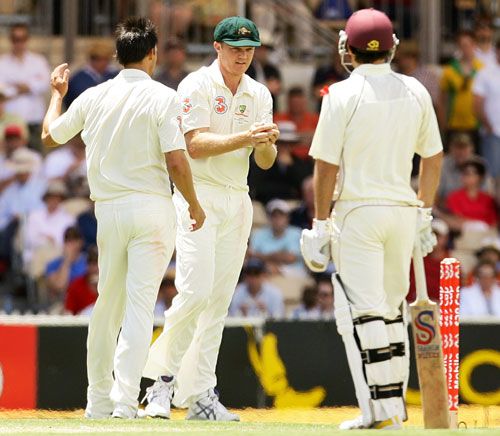 Doug Bollinger thinks he's caught Ravi Rampaul, but the ball bounced ...