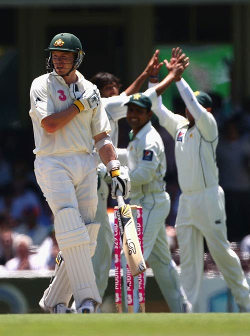 Peter Siddle holds his shoulder after being struck and caught behind ...