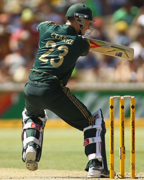 Michael Clarke works the ball on the way to his half-century ...
