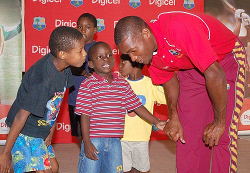 David Bernard listens patiently to his young admirers | ESPNcricinfo.com