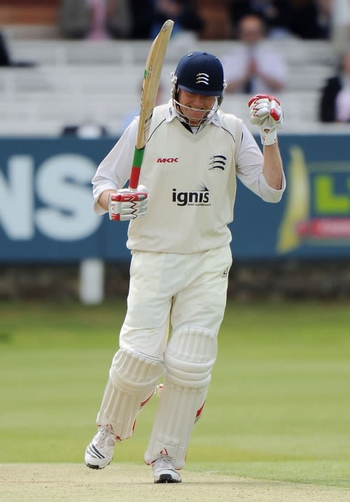 Shaun Udal punches the air after reaching his half century ...