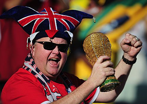 An English fan cheers during England's knockout game against Germany ...