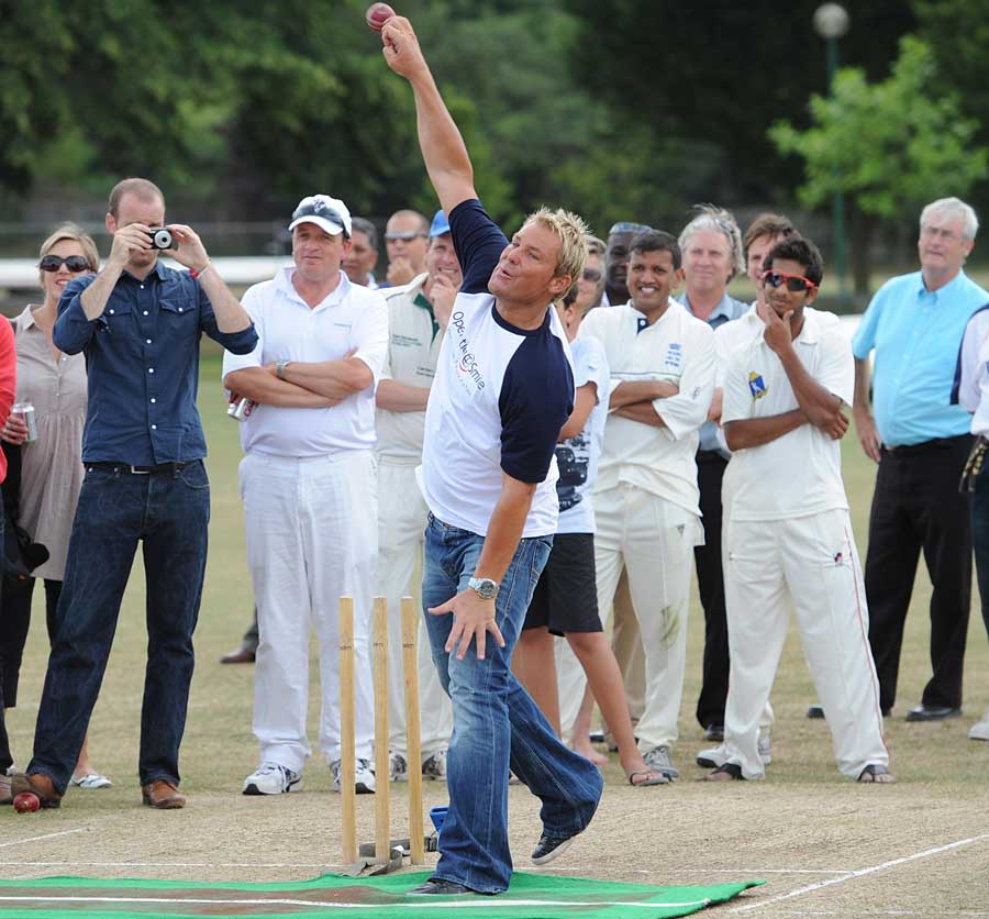 Shane Warne turns his arm over at an event in London | ESPNcricinfo.com