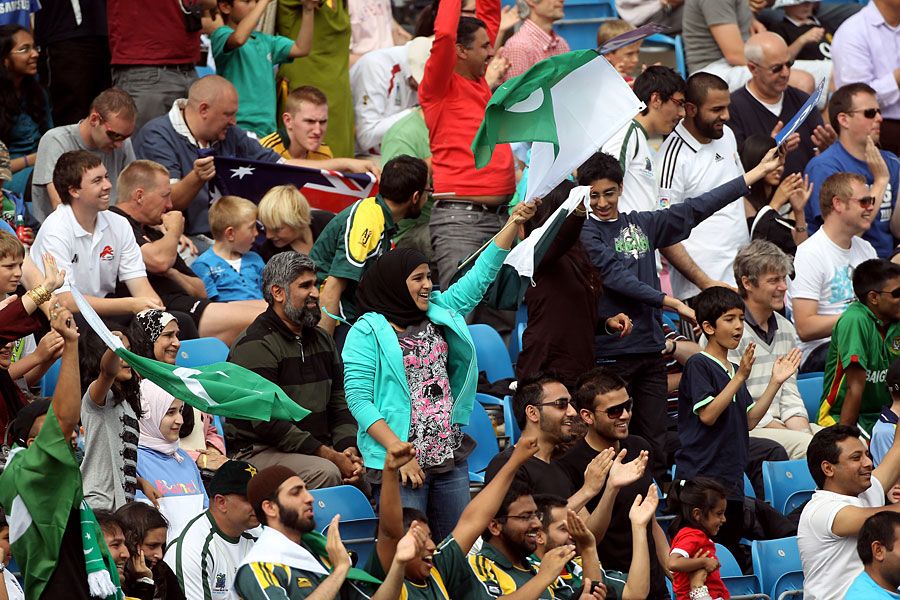 The Pakistan fans in the crowd celebrate as their team inched over the ...