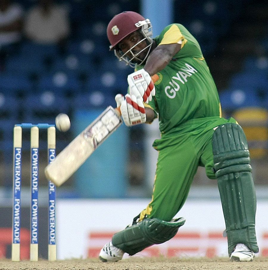 Travis Dowlin launches one over the off side during his fifty ...