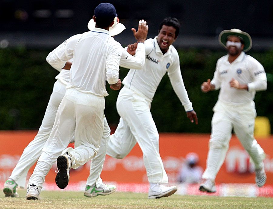 Pragyan Ojha celebrates the fall of a wicket | ESPNcricinfo.com