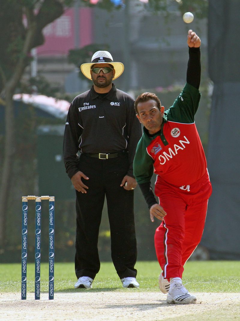 Oman's Khalid Rashid in action against Hong Kong at KCC | ESPNcricinfo.com