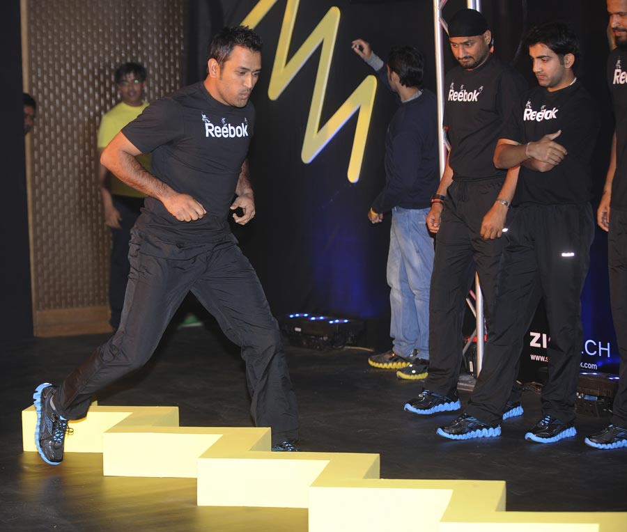 MS Dhoni performs an exercise at a promotional event | ESPNcricinfo.com