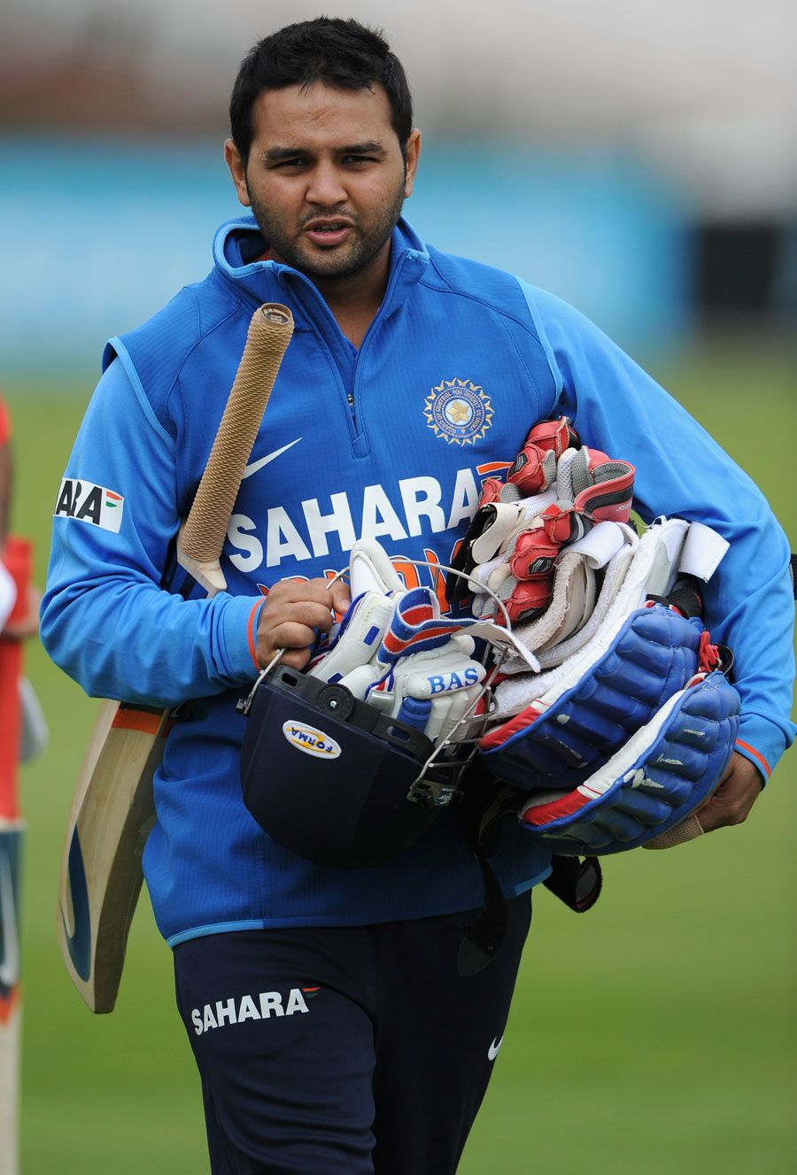 Parthiv Patel has an armful of equipment at India's training session ...