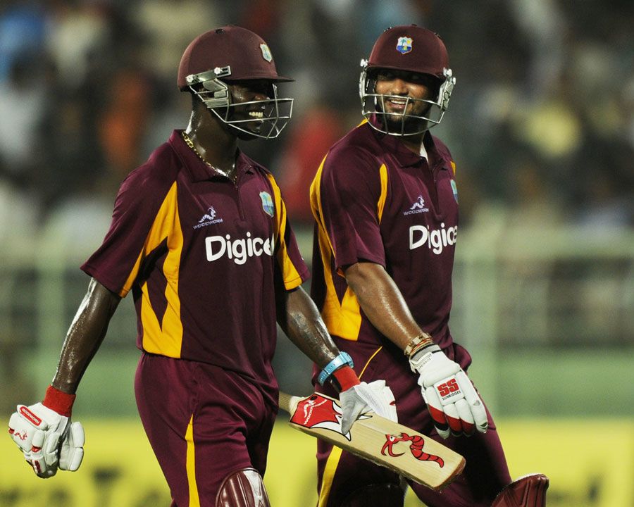 Kemar Roach and Ravi Rampaul walk off after their stand of 99 ...