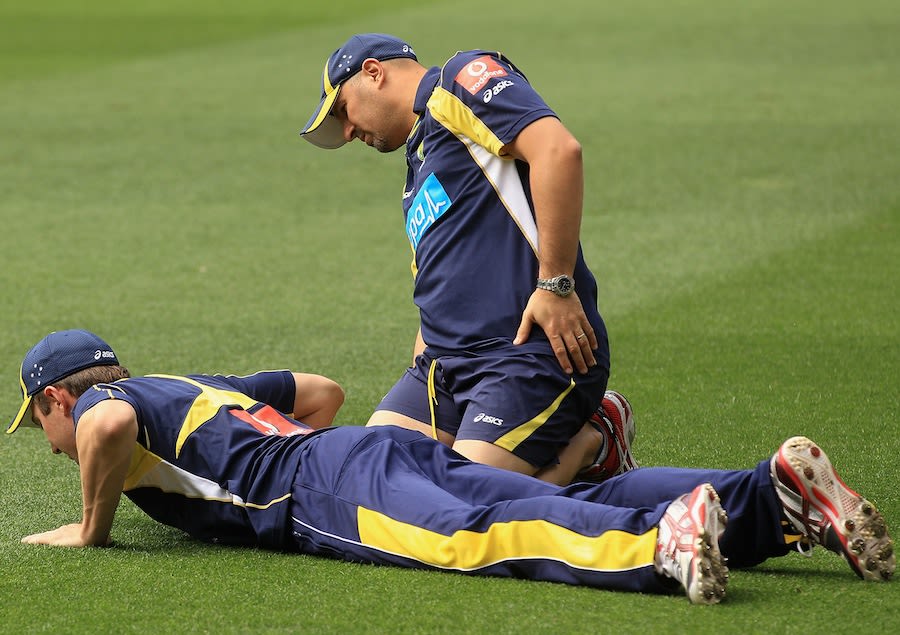 Australia's physio Alex Kountouris checks on Shaun Marsh | ESPNcricinfo.com