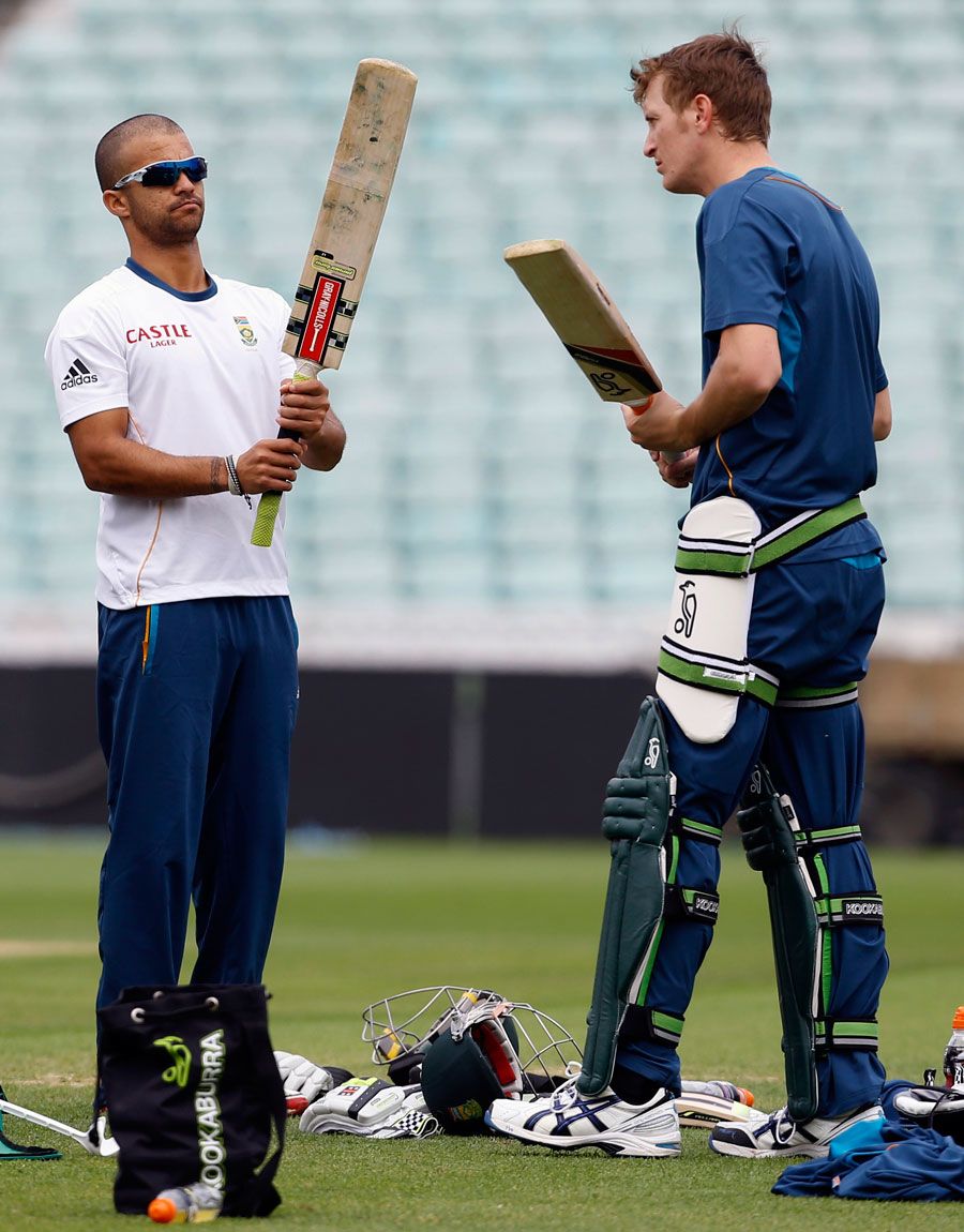 JP Duminy and Chris Morris discuss bats at a practice session ...