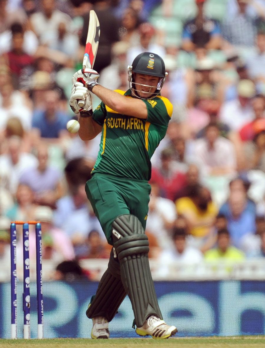 David Miller muscles the ball away during his half-century ...