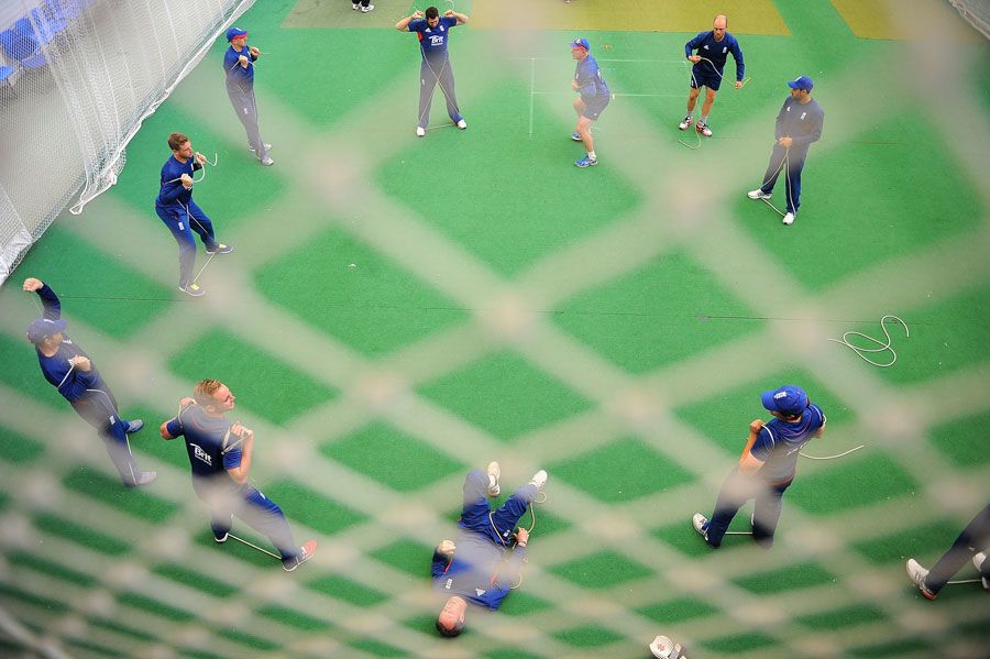 England players perform stretching exercises in a circle | ESPNcricinfo.com
