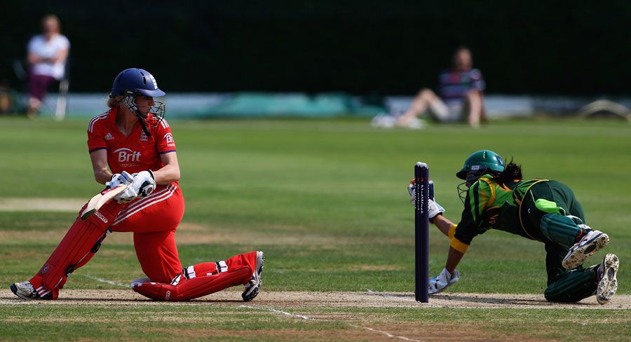 Susie Rowe looks on as Pakistan keeper Batool Fatima takes a catch ...
