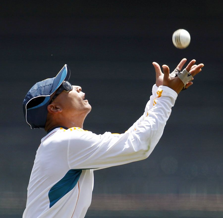 Henry Davids gets under a catch during a practice session ...