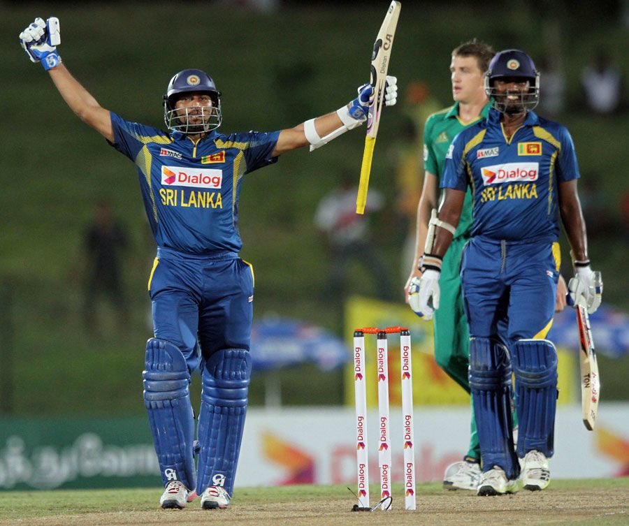 Tillakaratne Dilshan and Thisara Perera celebrate a consolation win over South Africa ...