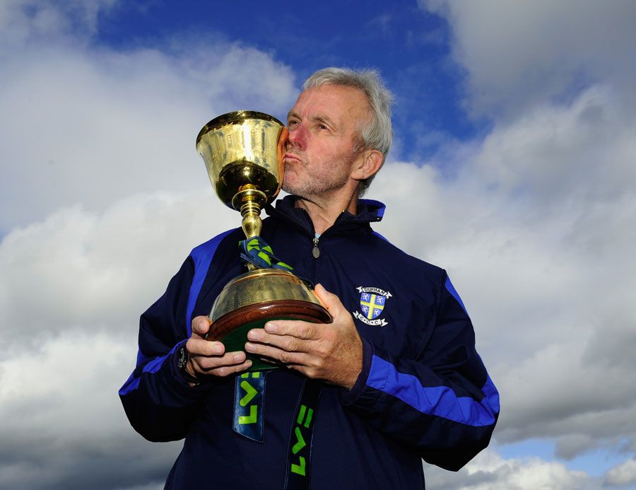 Geoff Cook kisses the Championship trophy | ESPNcricinfo.com