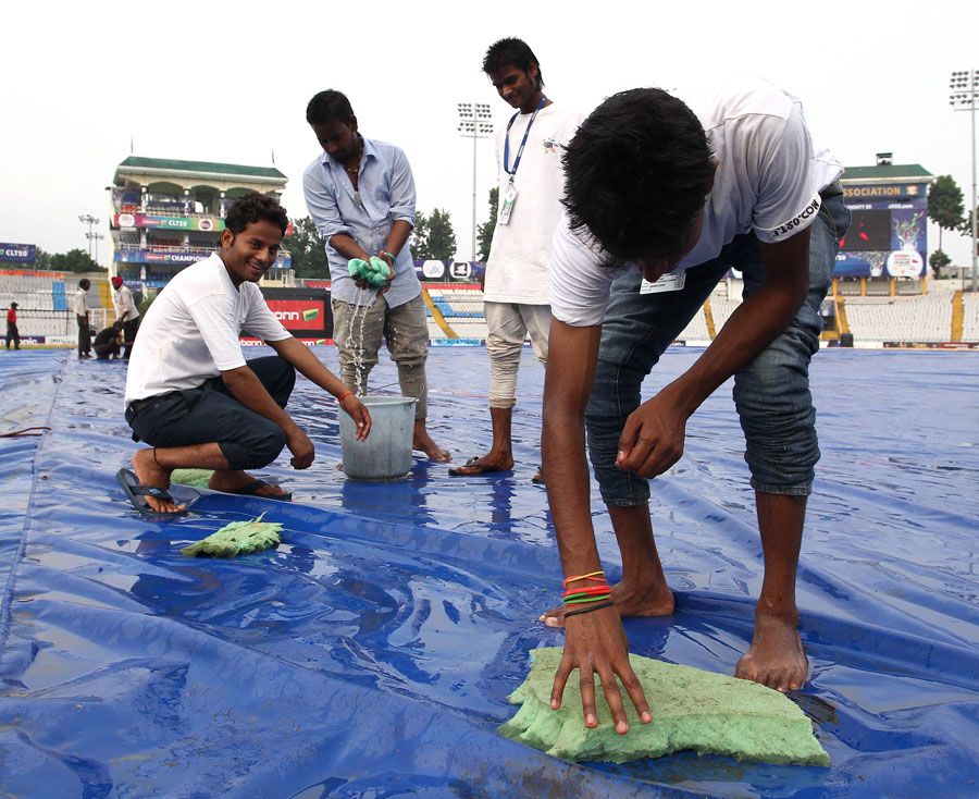 The Mohali ground staff were hard at work before the game ...