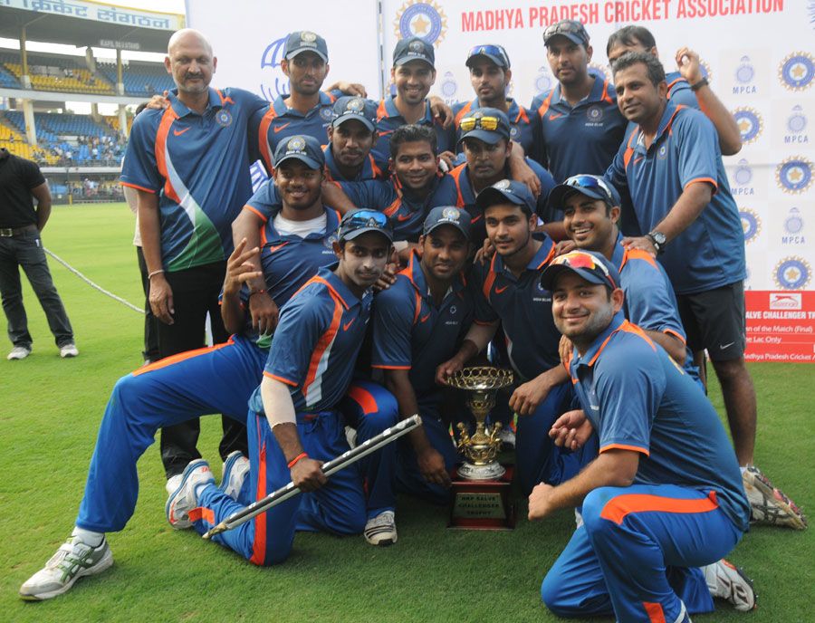 The victorious India Blue team with the NKP Salve Challenger trophy ...