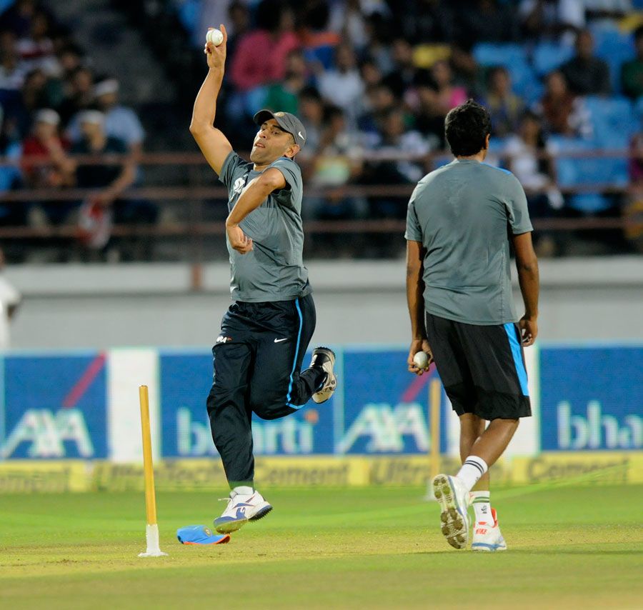 MS Dhoni has a bowl as he unwinds during practice | ESPNcricinfo.com